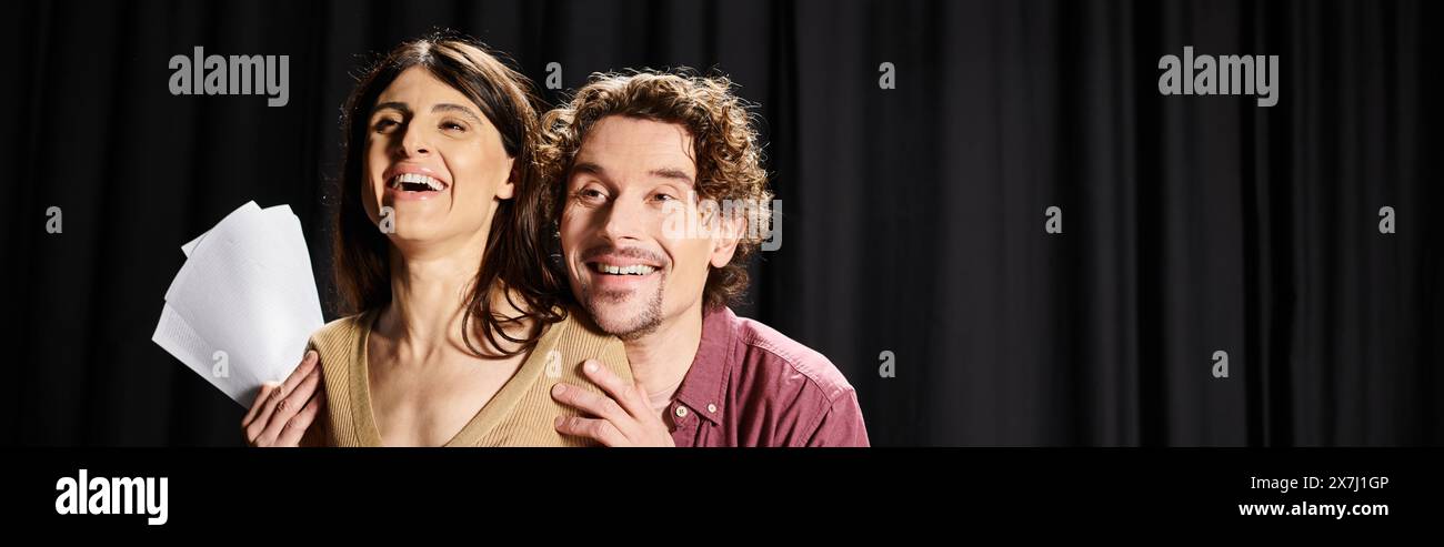 A man and a woman stand side by side, embodying their roles in a ...