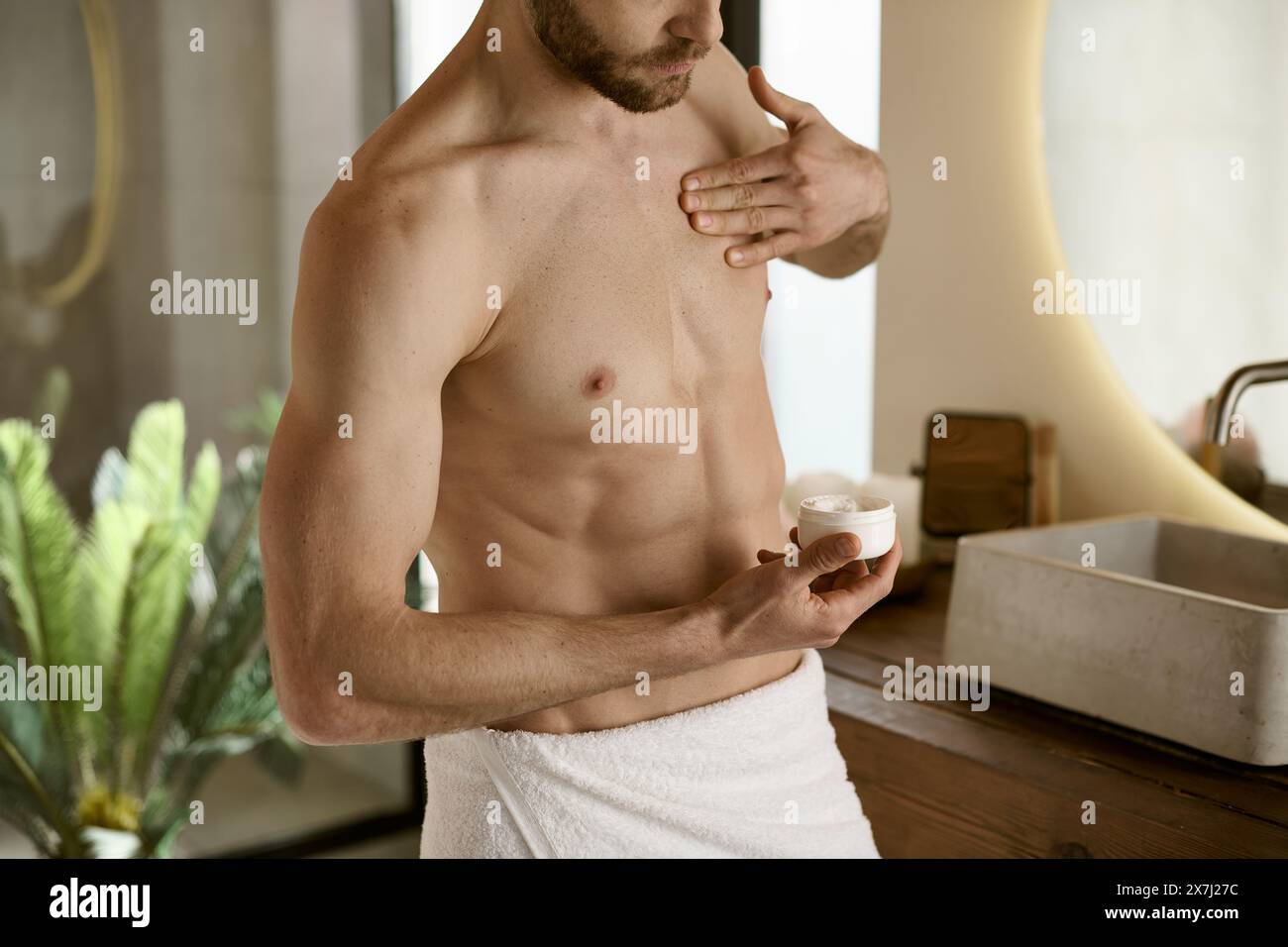 Man in towel applying hi-res stock photography and images - Alamy