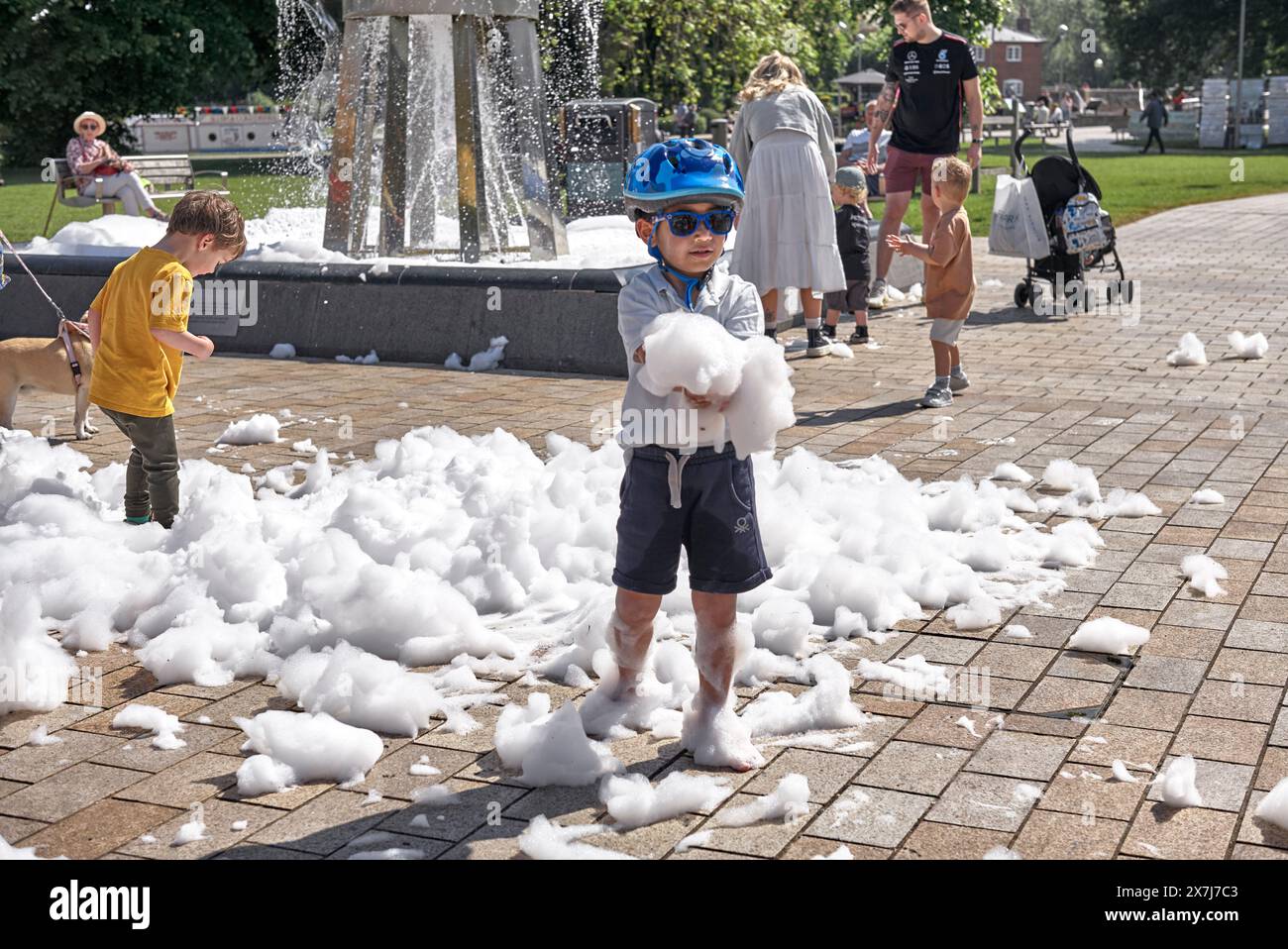 Children playing in foam bubbles outdoors. Stratford upon Avon, England ...