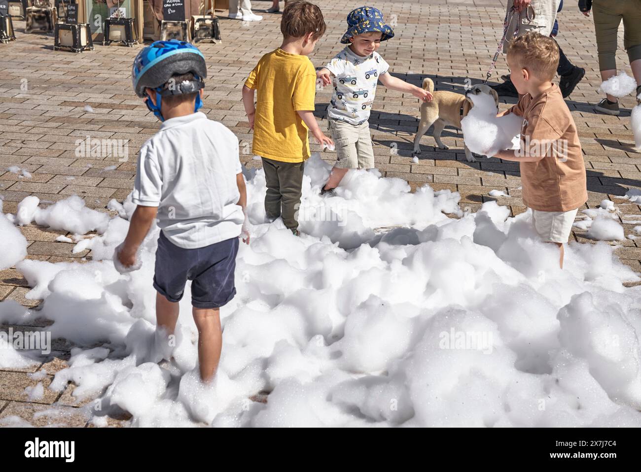 Children playing in foam bubbles outdoors. Stratford upon Avon, England ...