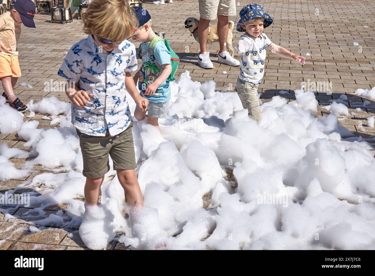Children playing in foam bubbles outdoors. Stratford upon Avon, England ...