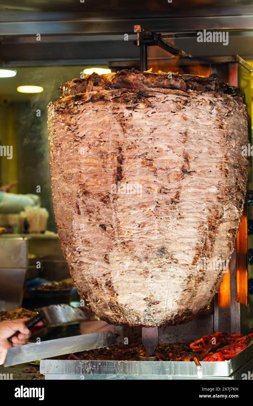 Kebab meat rotating, known as donor or shawarma. A popular street food ...