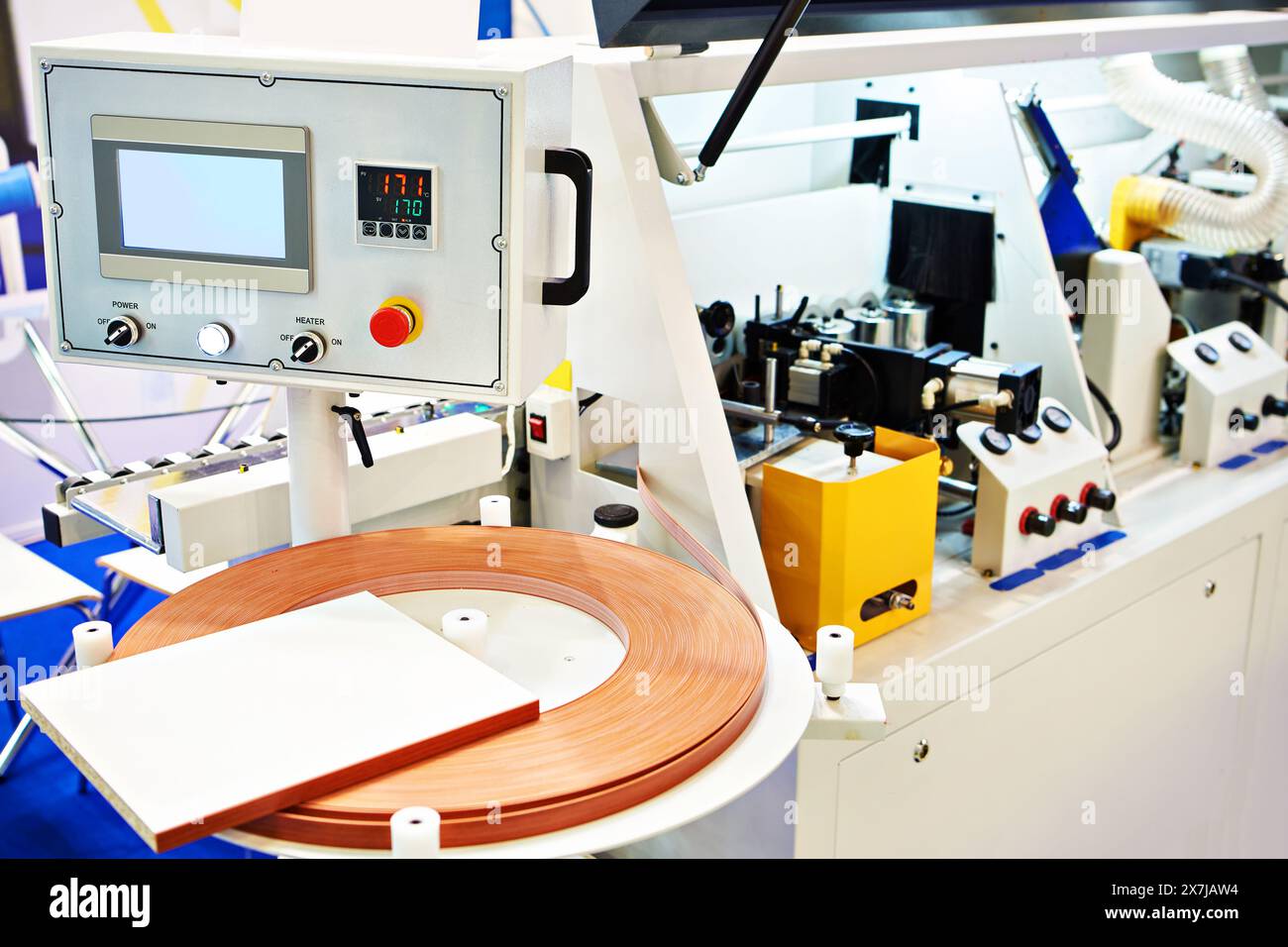 Single sided automatic edge banders on factory Stock Photo - Alamy