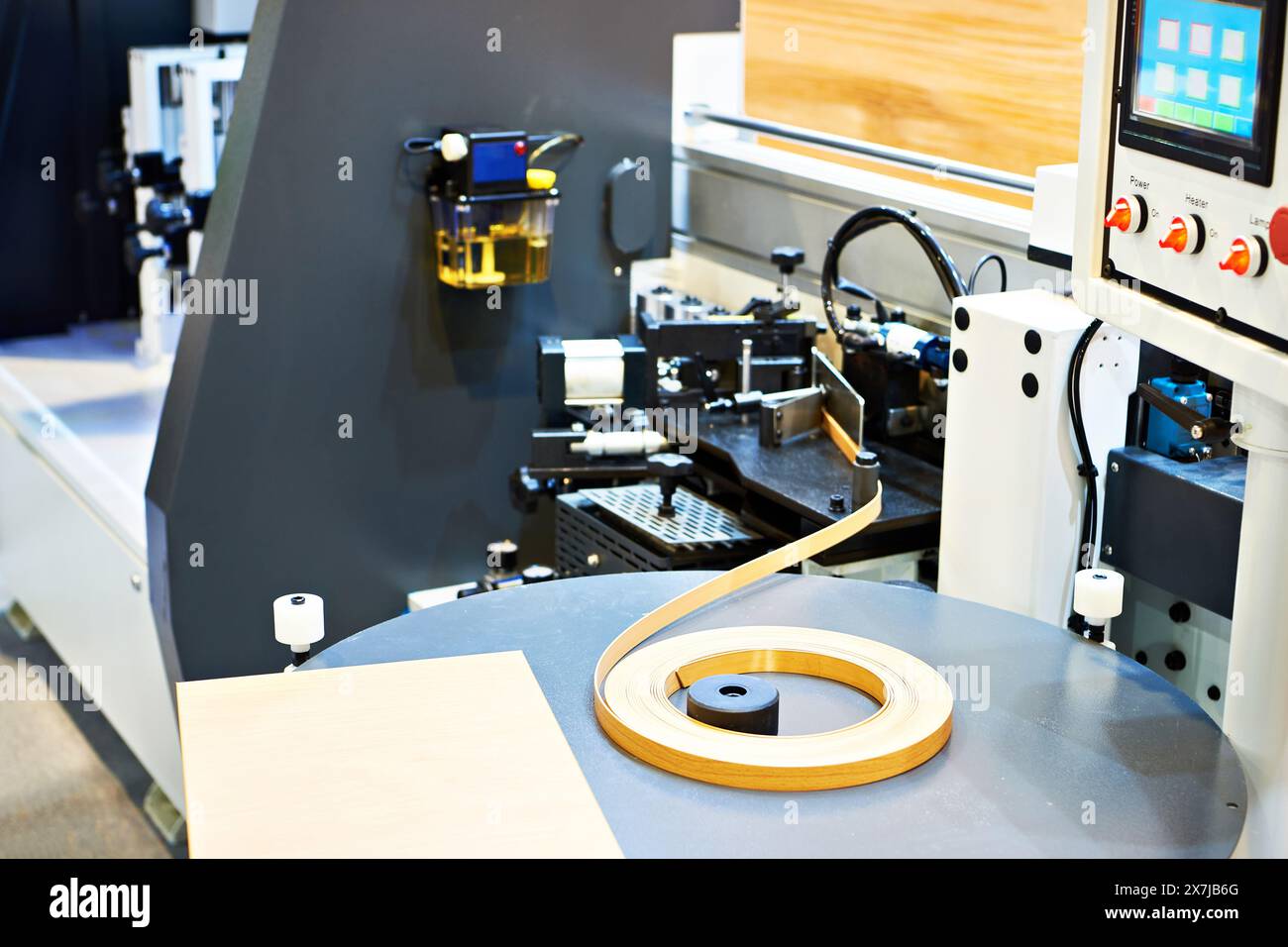 Single sided automatic edge banders on factory Stock Photo - Alamy