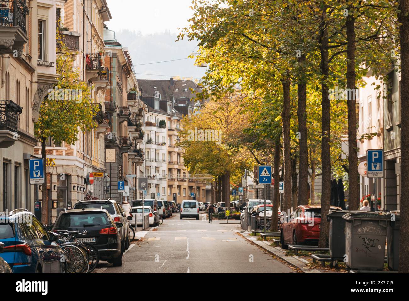 Looking down Hallwylstrasse, an inner city street in Zurich with ...
