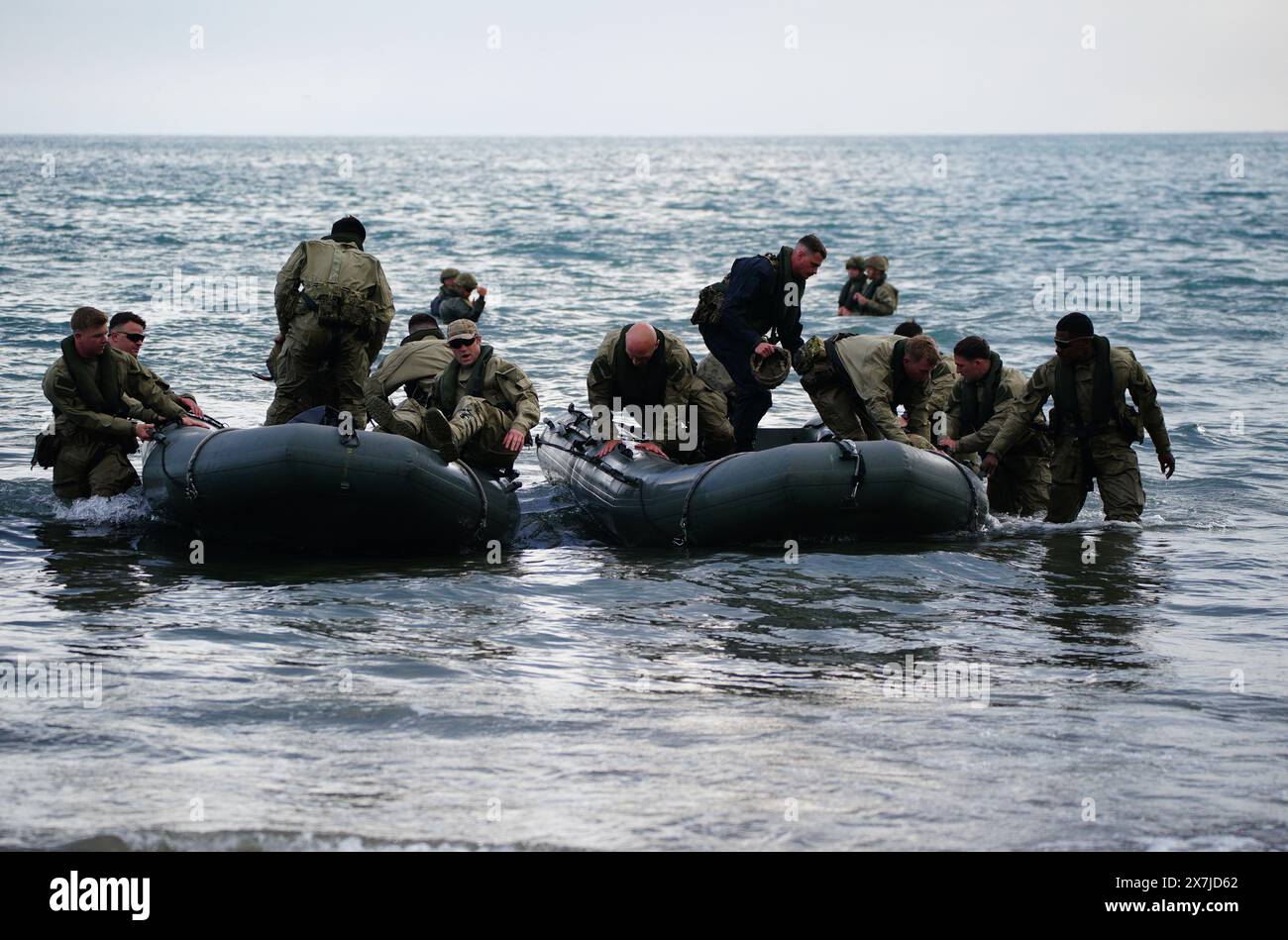 Armed Forces personnel from 47 Commando (Raiding Group) Royal Marines conduct beach landing ...