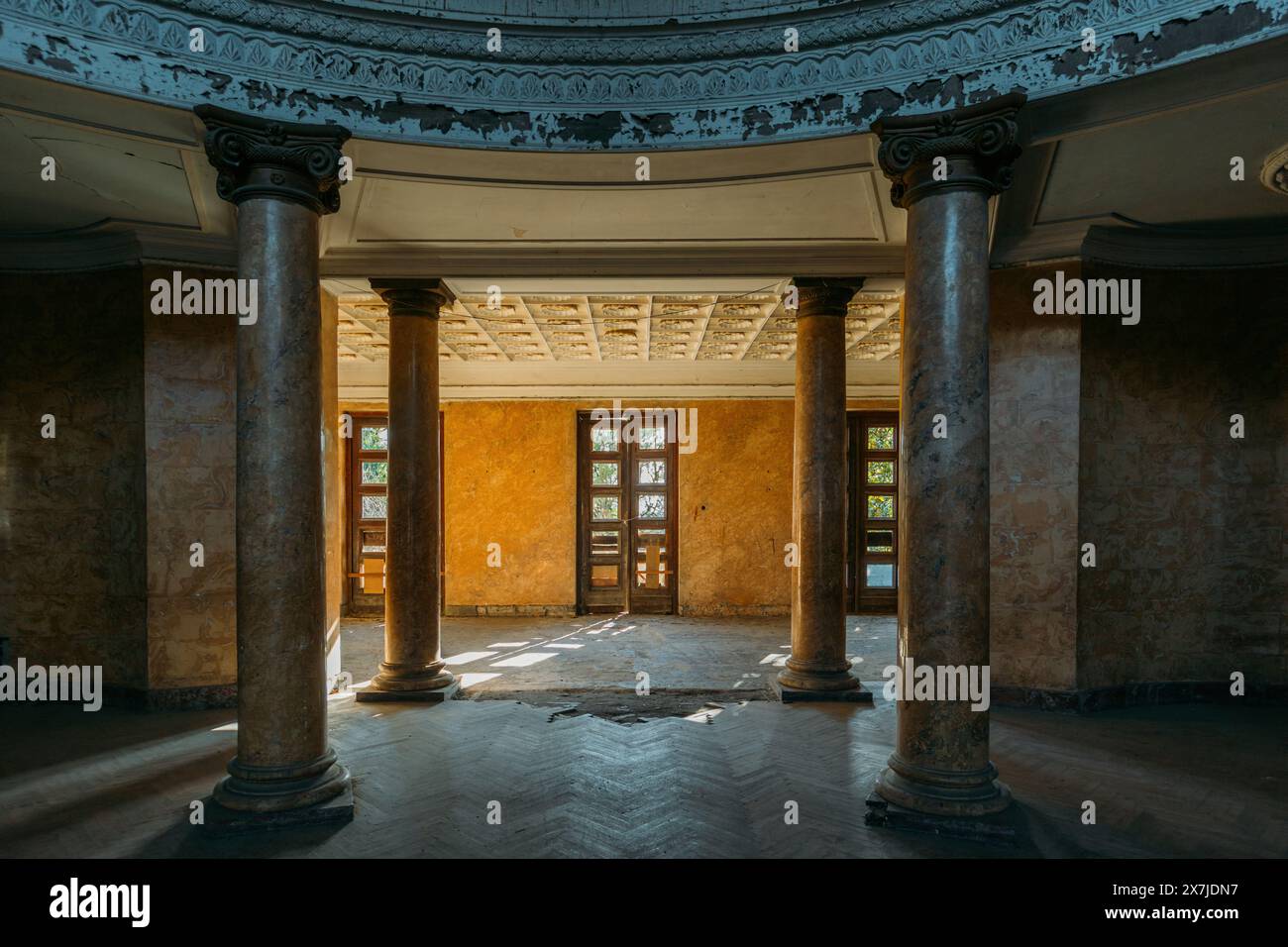 Entrance hall with columns in old abandoned mansion Stock Photo - Alamy