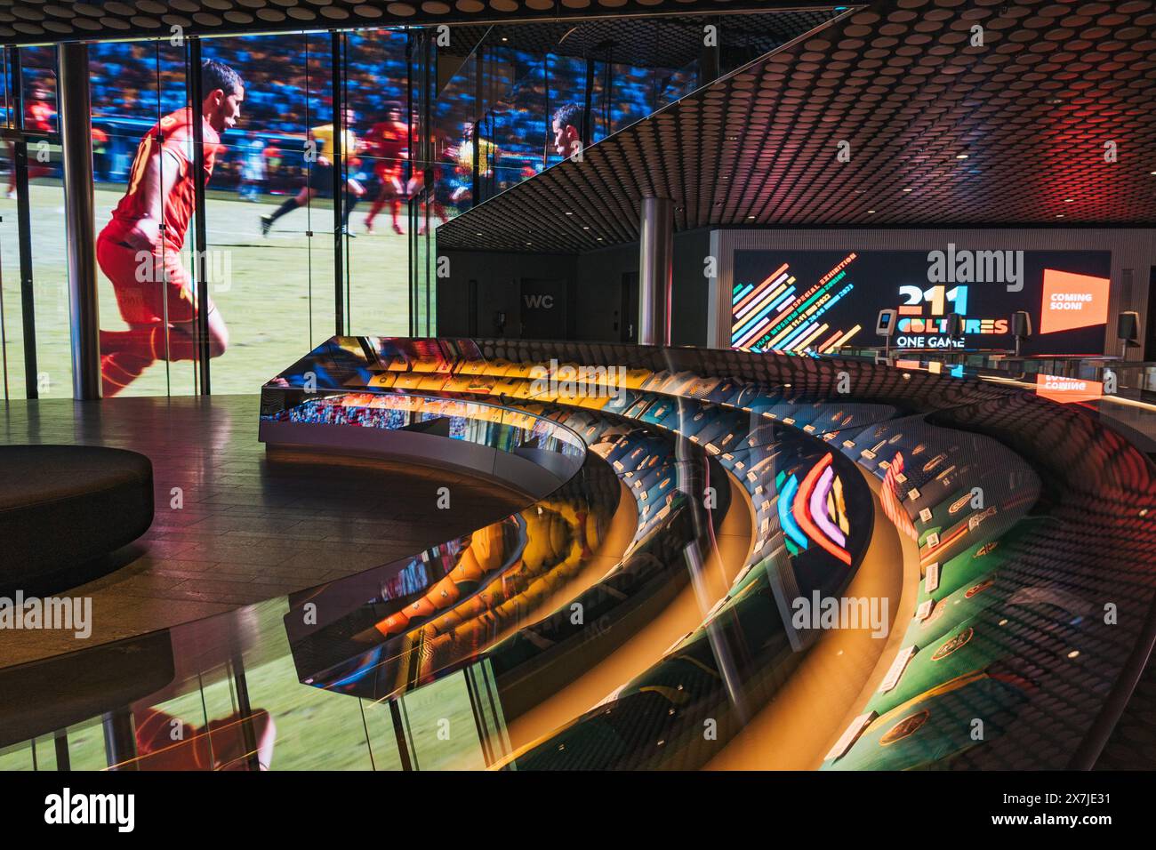 An exhibit with football screens and artifacts at the FIFA Museum ...