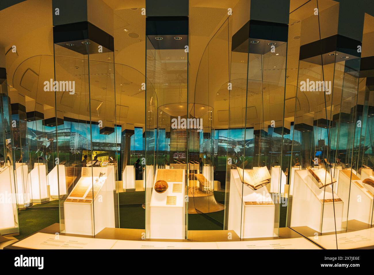 An exhibit with football screens and artifacts at the FIFA Museum ...