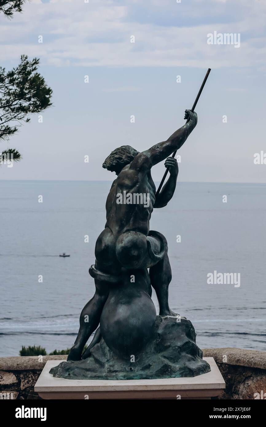 Saint Jean Cap Ferrat, France - 1 June 2023: Poseidon statue aside the ...