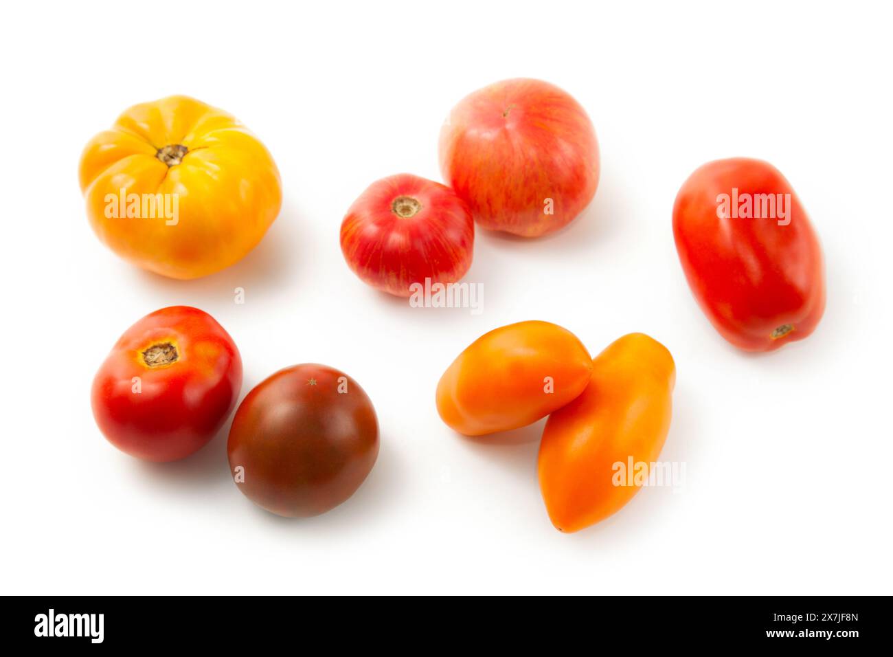 Assort of different shape and color whole ripe juicy tomatoes with soft ...