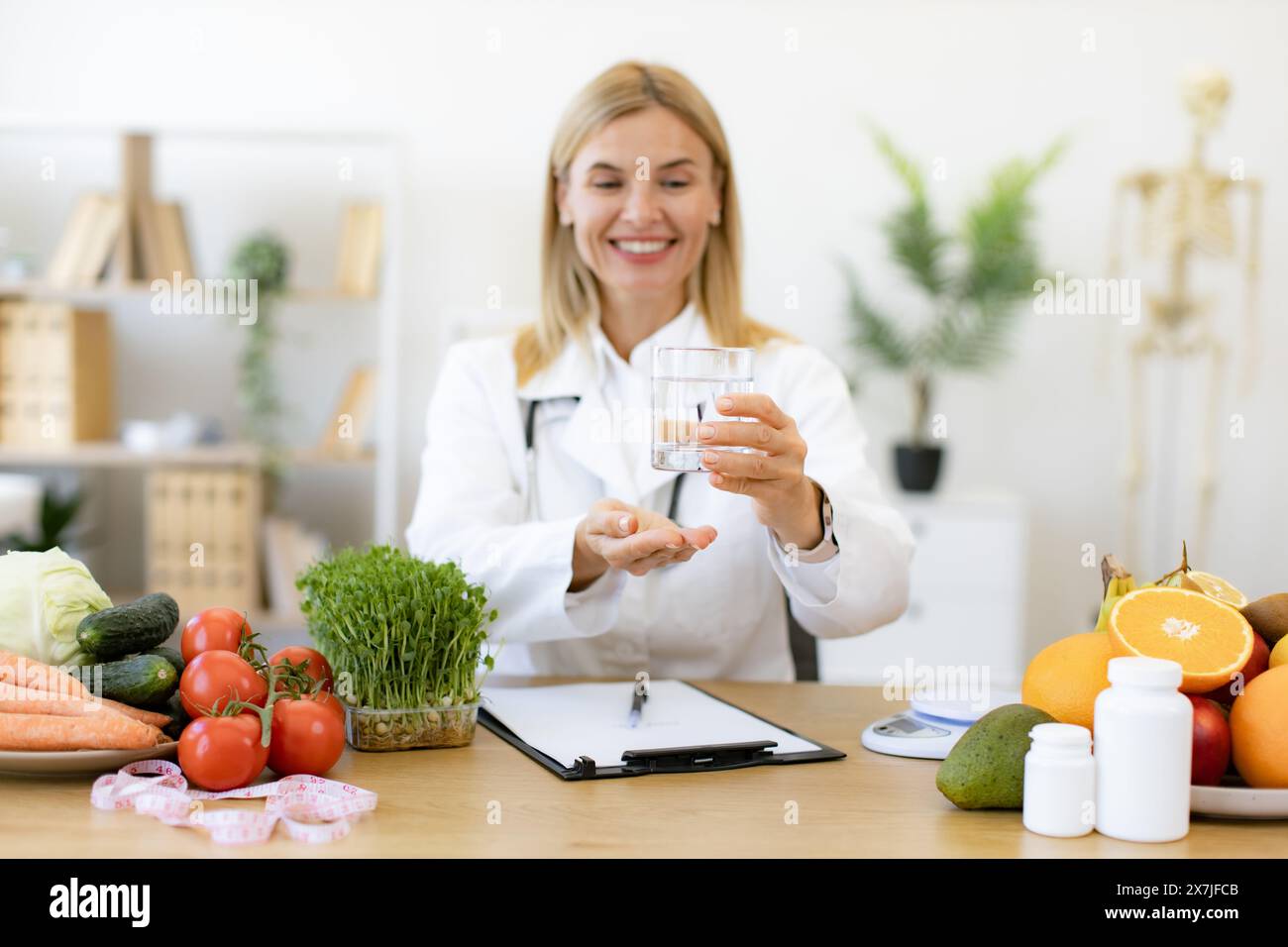 Portrait of mature lady posing with glass of clean water Stock Photo ...