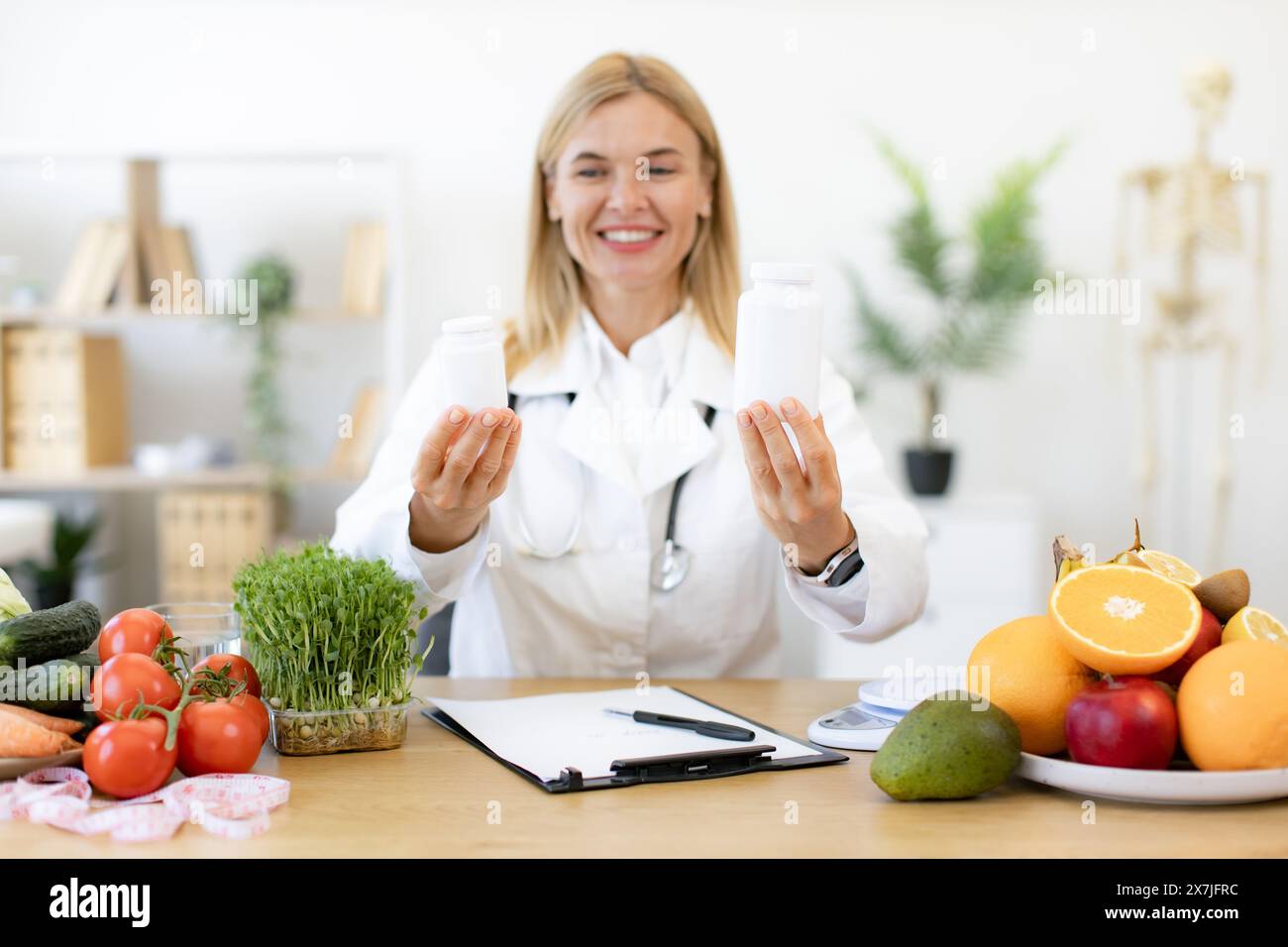 Cheerful expert in food proposing dietary supplements to improve ...