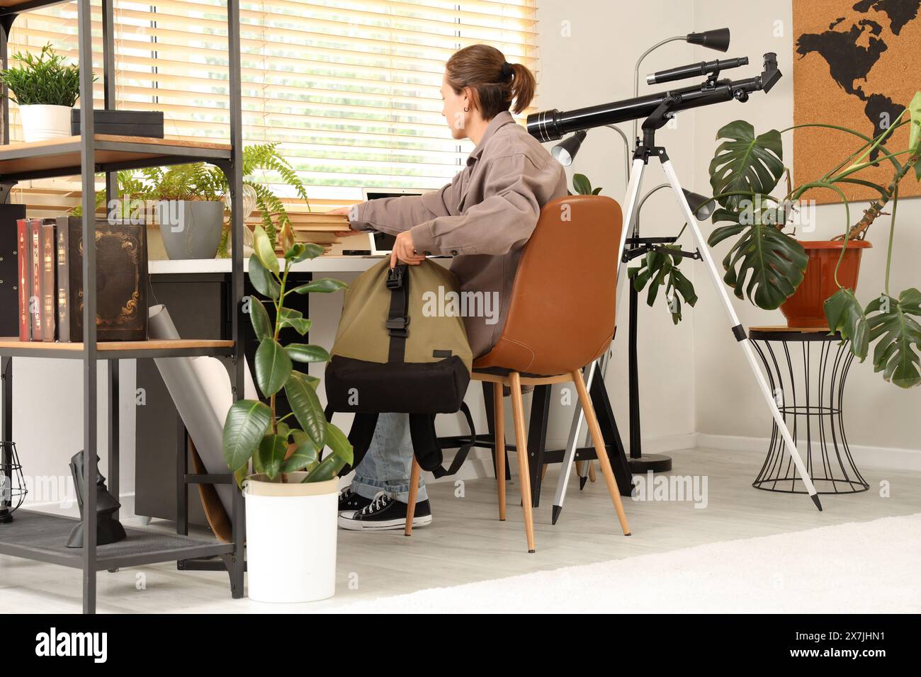 Girl packing books hi-res stock photography and images - Alamy