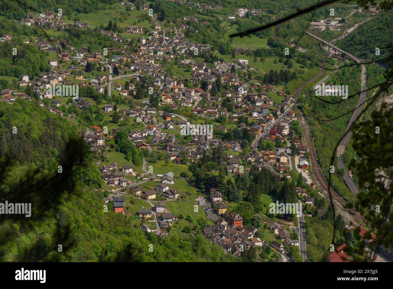 Aerial view for sunny color valley with trees and village Varzo Italy ...