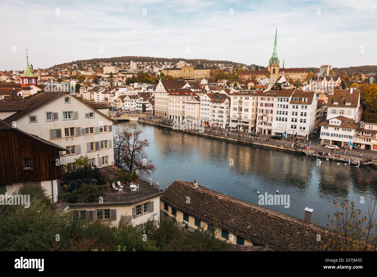 Zurich's Limmat riverfront on a calm autumn day, with old buildings ...