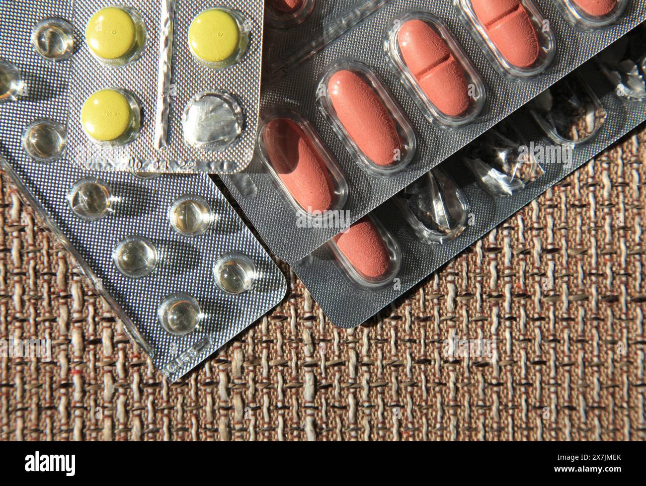 Colorful tablets in plastic blisters. Medicines in pharmaceutical ...