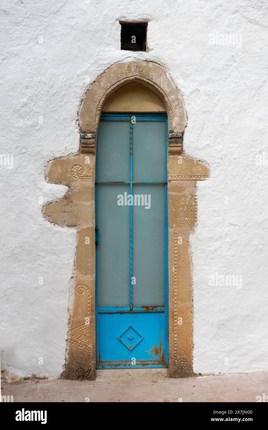 Metal blue door in an ancient Greek chapel Stock Photo - Alamy