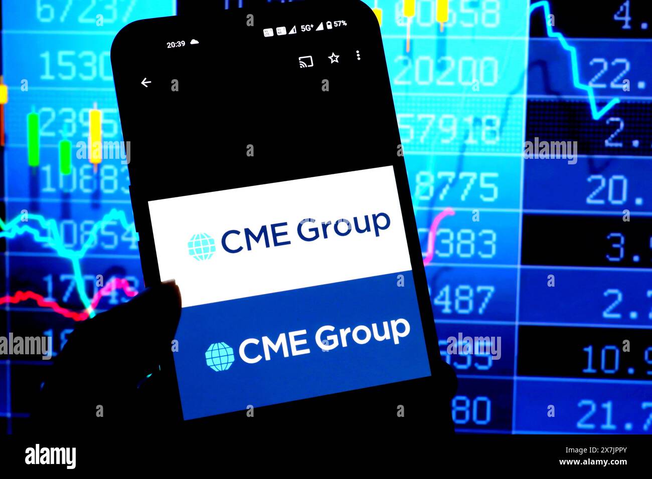 India. 19th May, 2024. In this photo illustration, a CME Group logo seen displayed on a ...