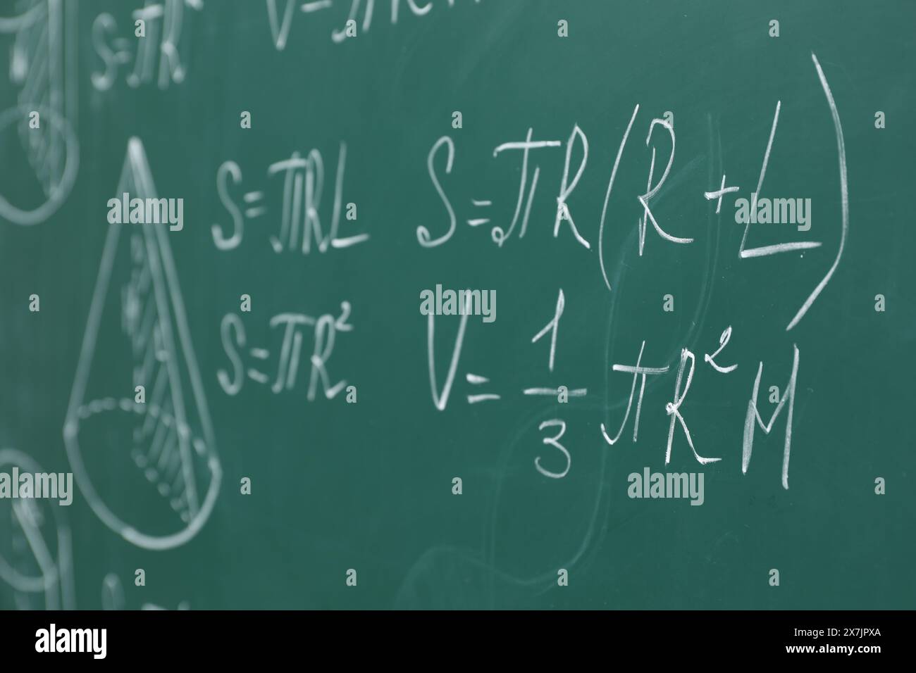 Different math formulas written with chalk on green board Stock Photo ...