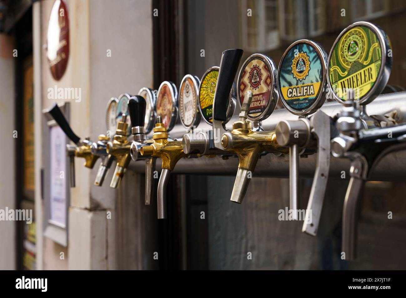 Warsaw, Poland - August 6, 2023: A line of draft beer taps installed on ...