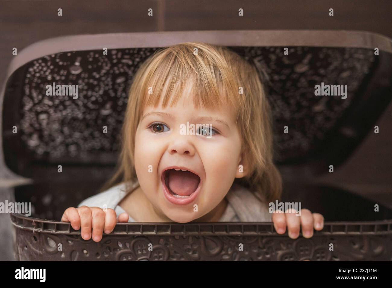 Kid hiding in bathroom hi-res stock photography and images - Alamy