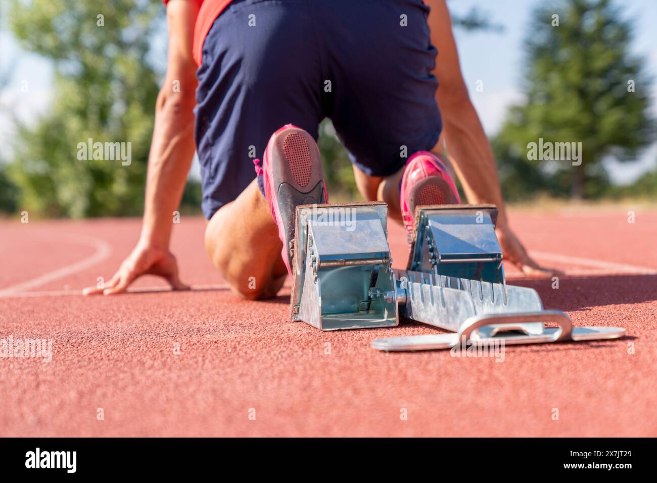 Stadium, man running and start block of athlete on a runner and arena ...