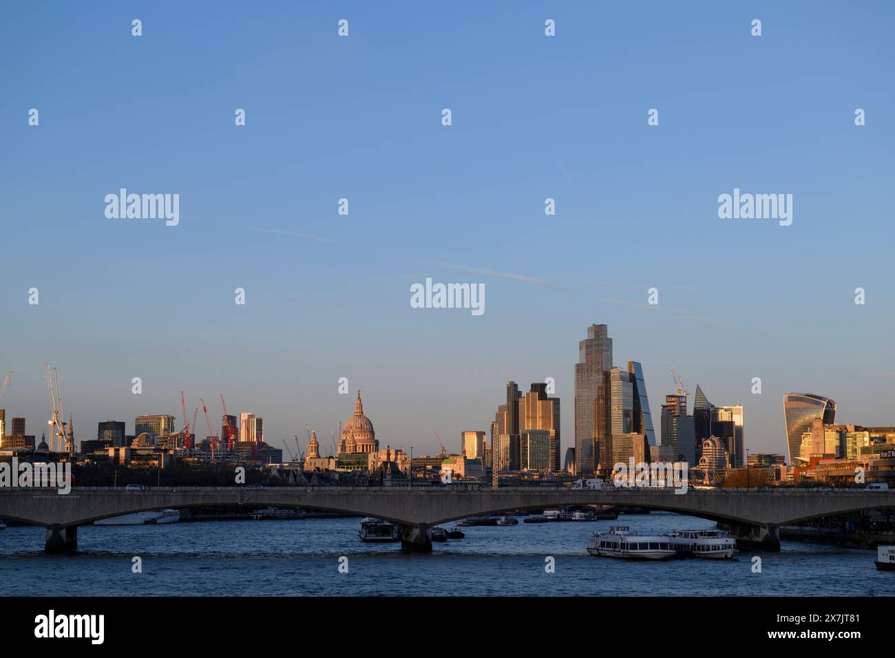 Waterloo Bridge over the river Thames with the dome of St. Pauls ...