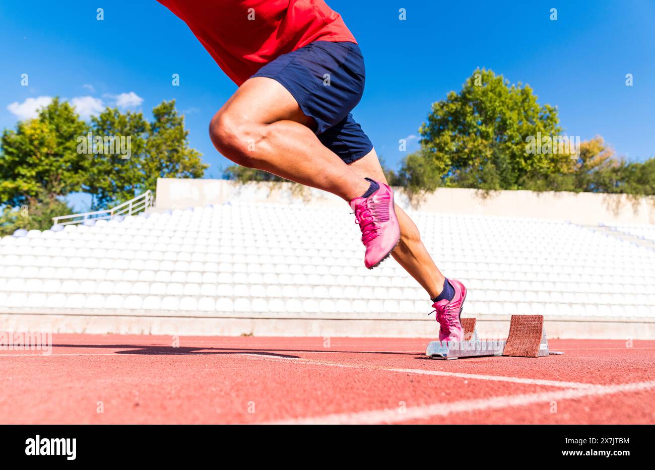 Stadium, man running and start block of athlete on a runner and arena ...