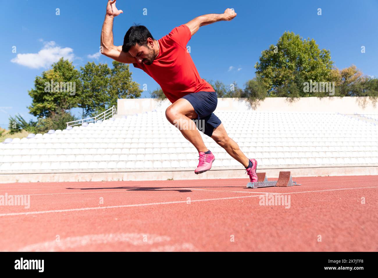 Stadium, man running and start block of athlete on a runner and arena ...