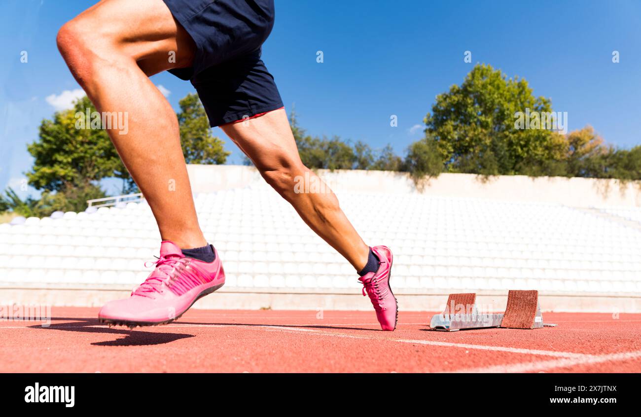 Stadium, man running and start block of athlete on a runner and arena ...