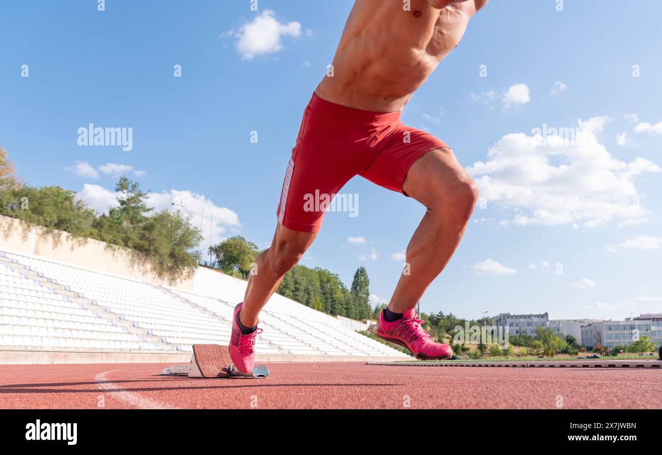 Stadium, man running and start block of athlete on a runner and arena ...