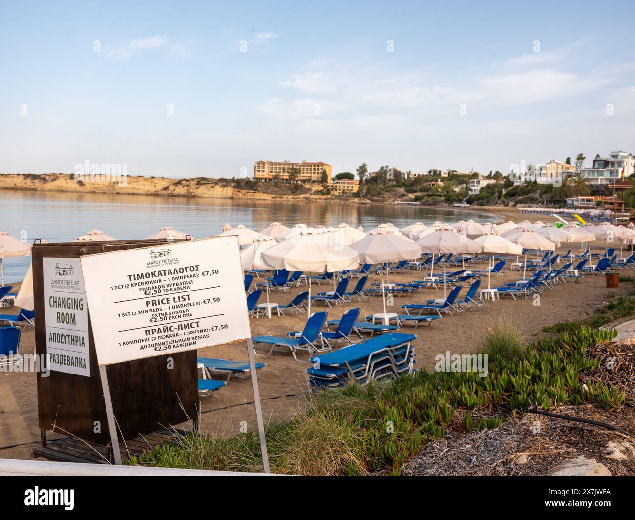 May 2024 - Rows of beach umbrellas and sunbeds near Pafos, Cyprus Stock ...