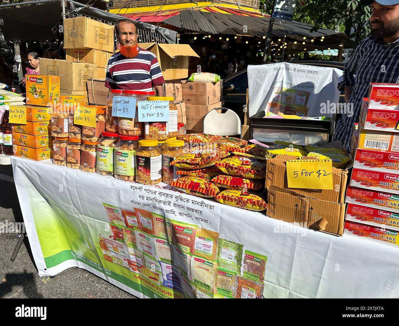 Man selling food at Bangladeshi street fair in the Kensington section ...