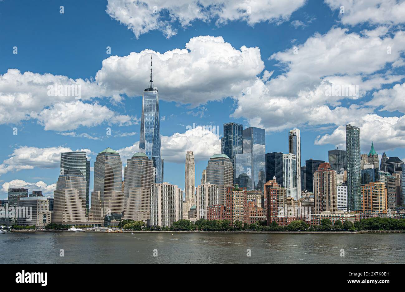 New York, NY, USA - August 1, 2023: Lower Manhattan seen from Hudson river mouth. One World ...