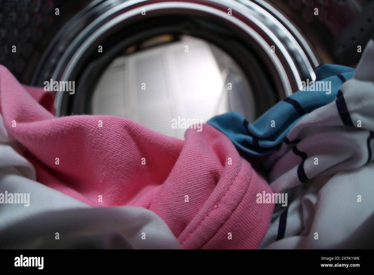 Clothes in washing machine indoors, view from inside. Laundry day Stock ...
