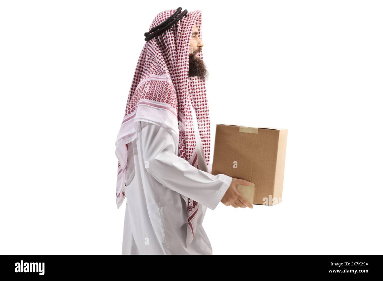 Saudi arab man walking with a cardboard box isolated on white ...