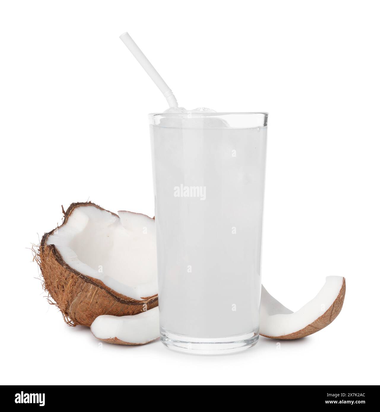 Glass of coconut water, ice cubes and nut isolated on white Stock Photo ...