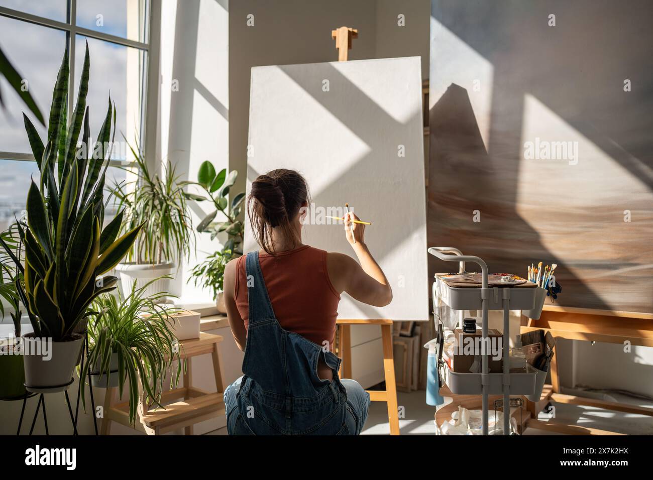 Creativity, drawing or sketch painter woman ready to start on artwork project on clean easel ...