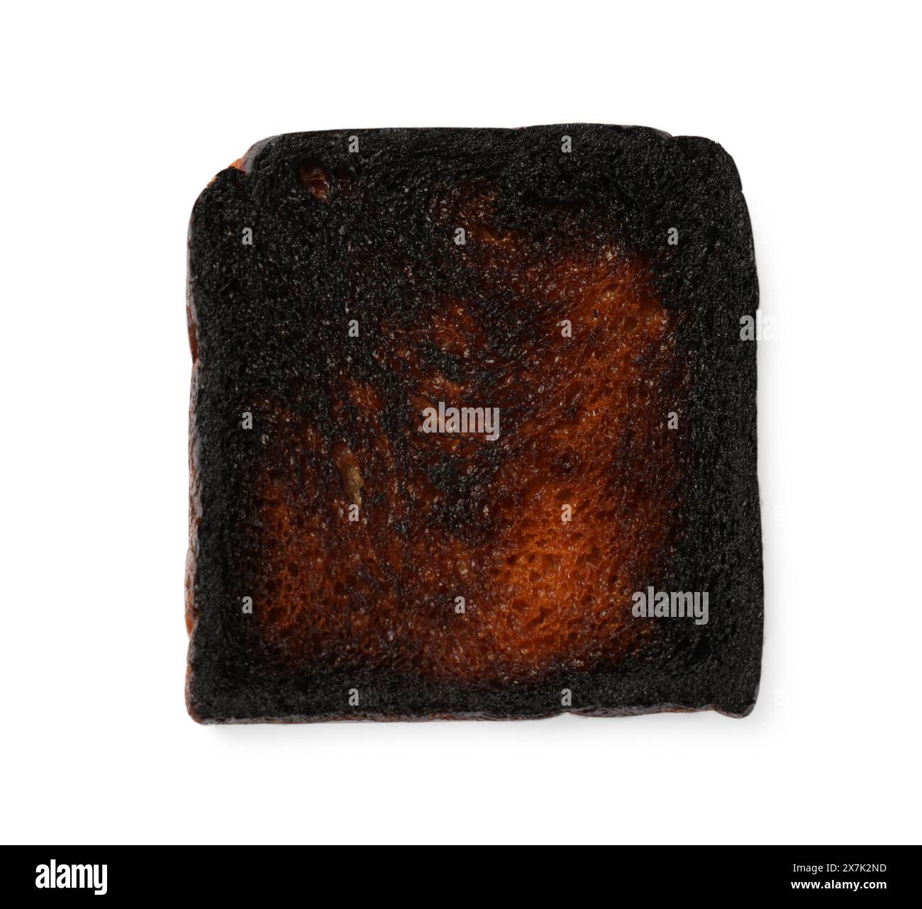 One burnt piece of toast bread isolated on white, top view Stock Photo ...
