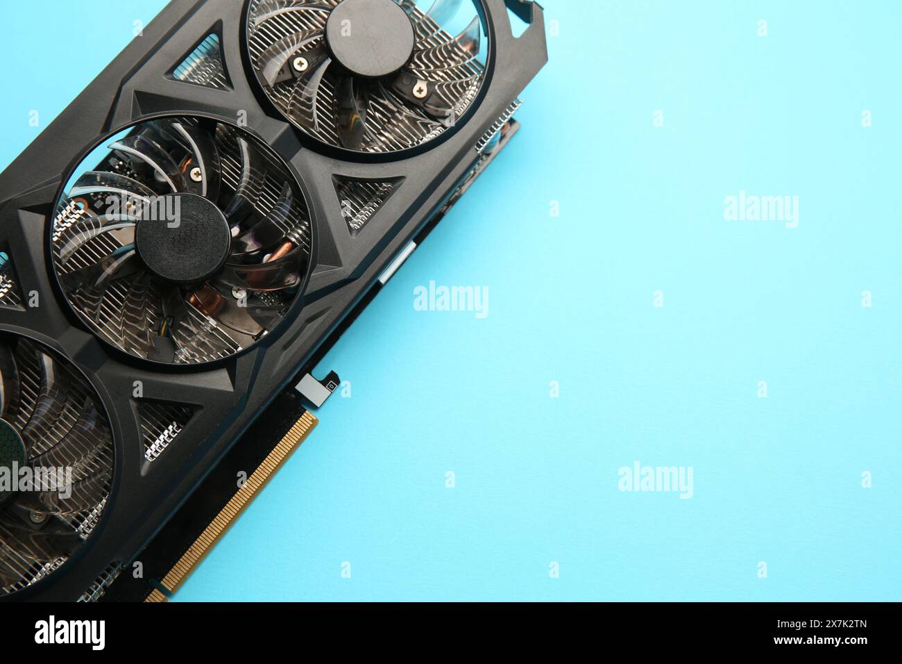 One graphics card on light blue background, top view. Space for text ...