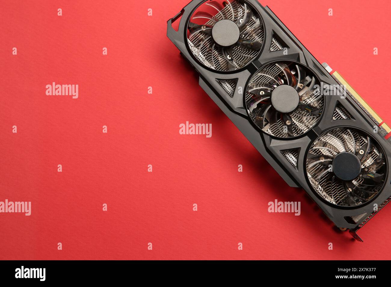 One graphics card on red background, top view. Space for text Stock ...