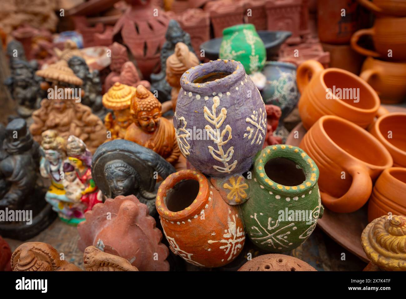 Indian hand made clay pots art and various religious symbols made from ...