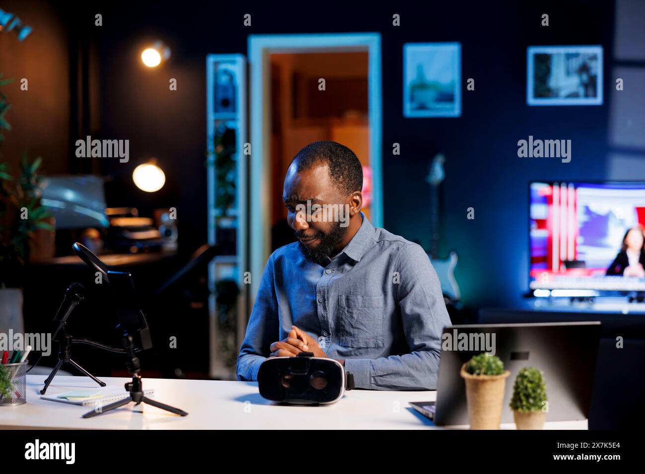 Tech content creator filming technology review of newly launched VR ...