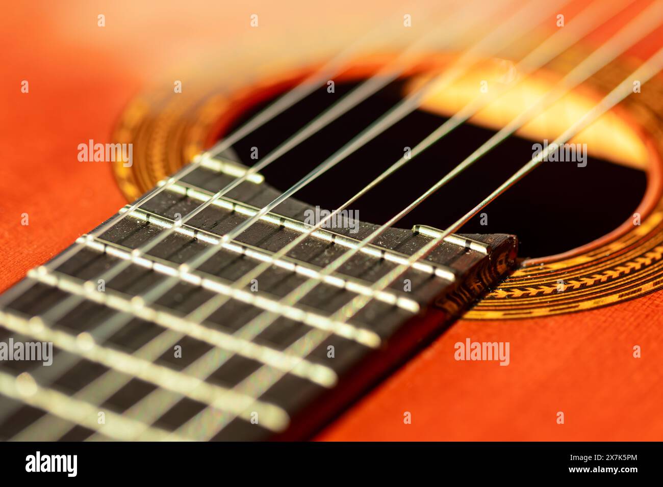 Strings over acoustic guitar hole. Sound hole of wooden guitar Stock ...