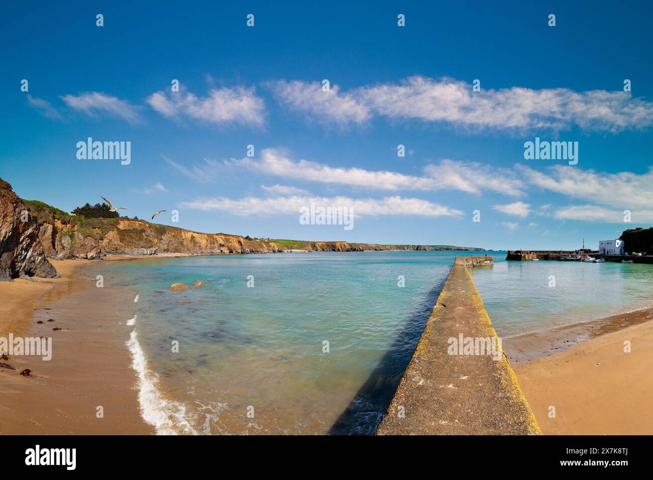 A pier in Boatstrand Harbour in County Waterford, Ireland. The small ...