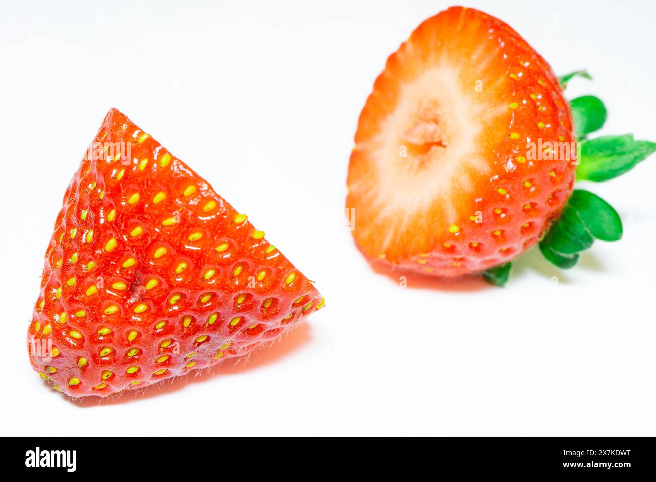 Close up from a strawberry cut in half, on a white background Stock ...