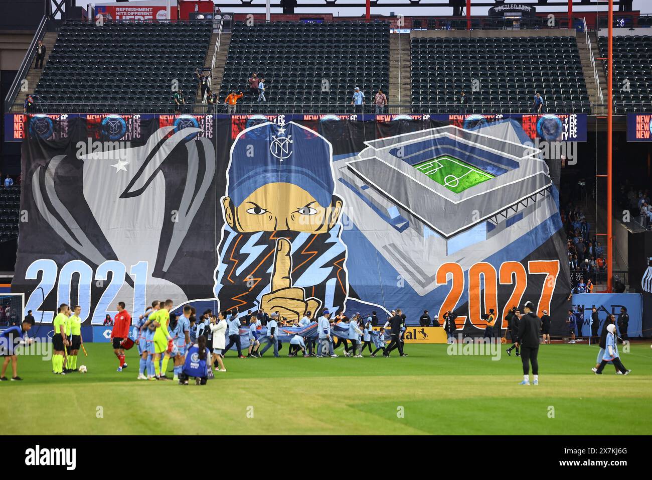 A banner is dropped from Coca Cola Porch on the field before the Major ...