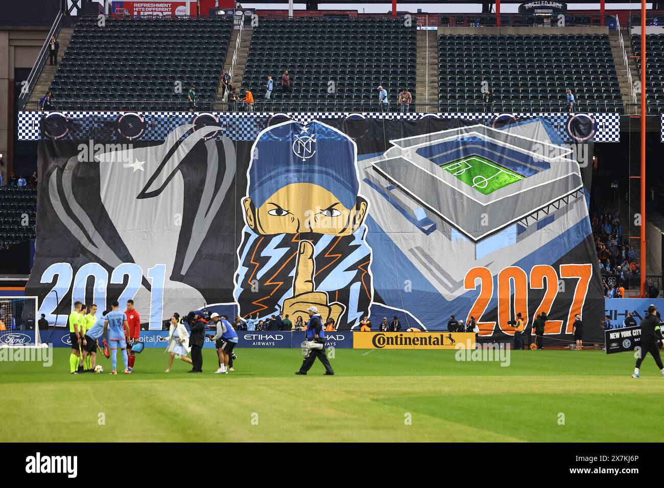 A banner is dropped from Coca Cola Porch on the field before the Major ...