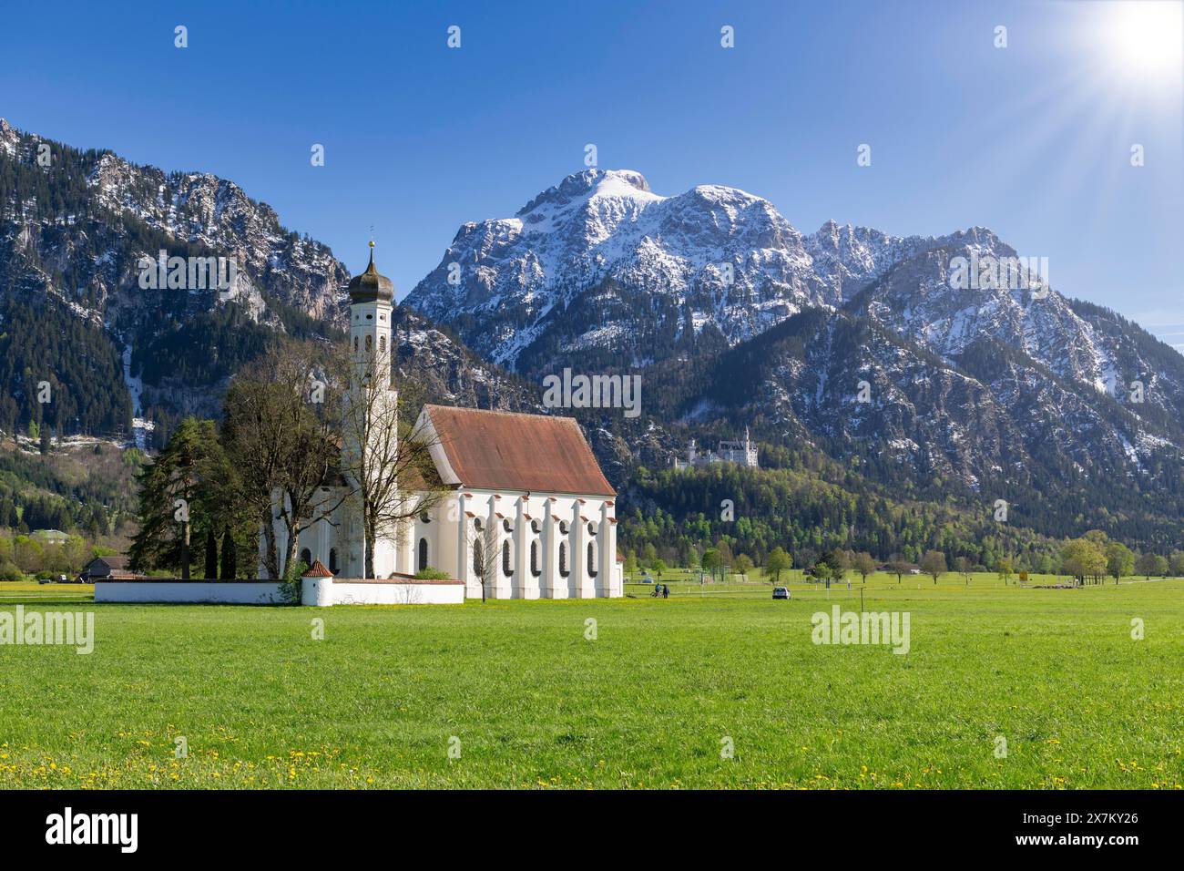 Pilgrimage church of St Coloman in spring, sun, behind Neuschwanstein ...